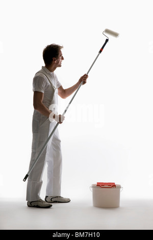 Painter using roller Stock Photo - Alamy