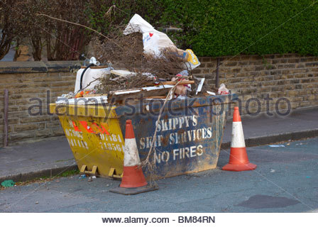 Overloaded skip on a building site - waste segregation Stock Photo ...