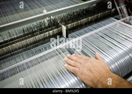 Loom operator. Weaving machine, looms and weaver, Melin Tregwynt, a 200 ...