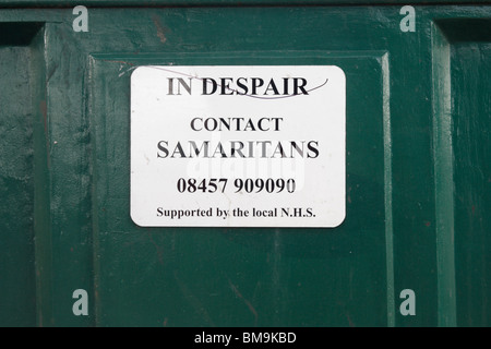Samaritans sign with telephone helpline number Stock Photo - Alamy