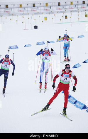 Austrian biathletes Dominik Landertinger in action during the 4 x 7.5 ...