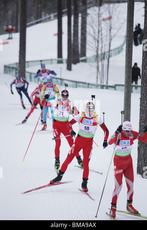 Austrian biathletes Dominik Landertinger in action during the 4 x 7.5 ...