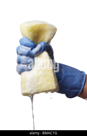 Hand holding a yellow sponge dripping with soapy water Stock Photo - Alamy