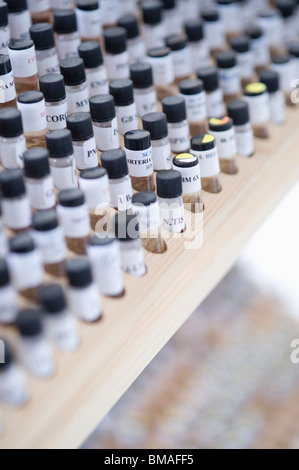 Vials in wooden stand Stock Photo - Alamy