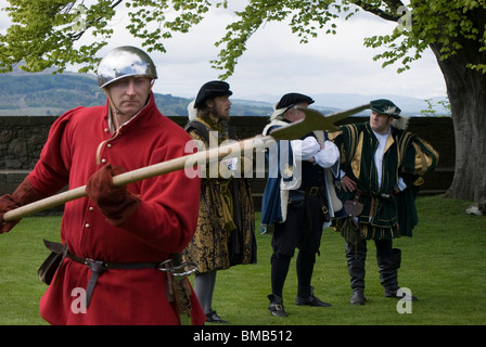 16th century Scottish Soldier of the Guard firing a fuselock rifle ...