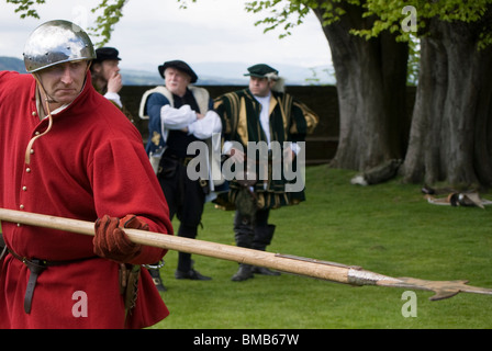 16th century Scottish Soldier of the Guard firing a fuselock rifle ...
