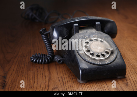 an old, dusty black rotary phone Stock Photo - Alamy