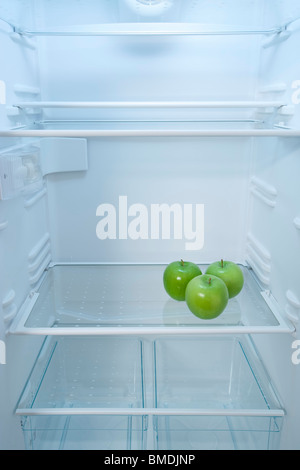Apples in open empty refrigerator. Weight loss diet concept Stock Photo ...