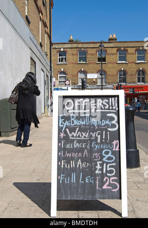 handwritten billboard advertising eyebrow threading, body waxing, and ...