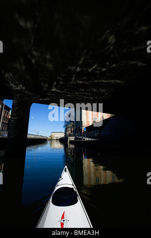Boat pass below bridge with city urban architecture in Chongqing, China ...