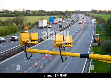 Yellow speed camera above motorway bridge, M62, Warrington, Cheshire ...