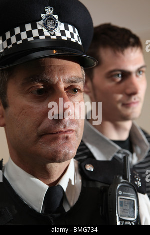 a portrait of a metropolitan police officer with a polish man stood ...