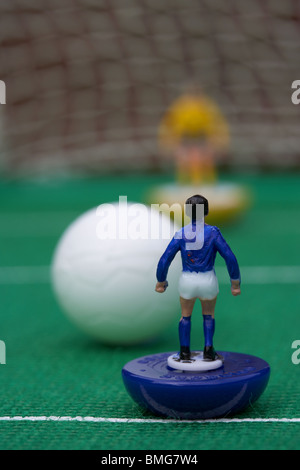 Vintage Subbuteo toy football player and goal keeper, isolated on white ...