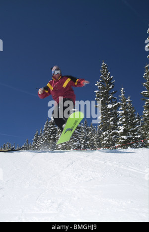 Snowboarder catching some air Stock Photo - Alamy