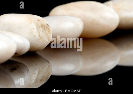 Concept made by many rocks isolated on black Stock Photo - Alamy