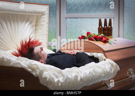 A Deceased Young Man In A Coffin With Syringes Laying On Top Stock ...