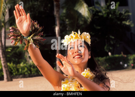 Close-up of female hula dancer's feet with purple ankle leis, during a ...
