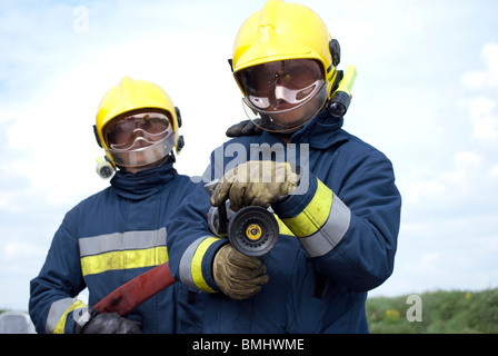 Two firefighters ready for action Stock Photo - Alamy
