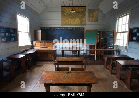 A nineteenth (XIX) century (1800s) classroom with wooden benches, a ...