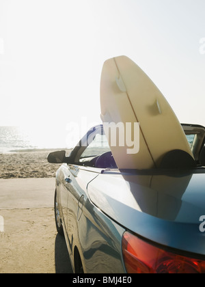 Surfboard in convertible car Stock Photo - Alamy