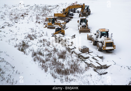 bulldozer at construction site covered with snow Stock Photo - Alamy