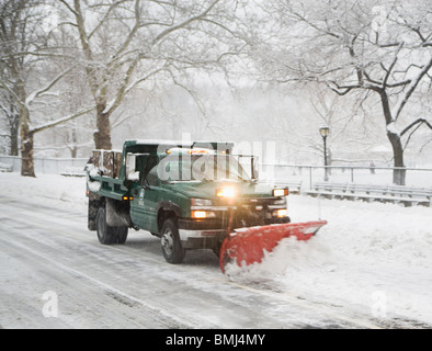 Sanitation Department truck plows snow Sunday's blizzard around ...