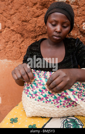 Lady weaving traditional baskets. Rwanda Stock Photo - Alamy