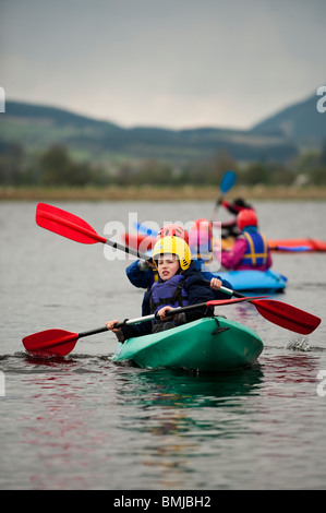 Children paddling kayaks at The Urdd outward bound activity Centre ...
