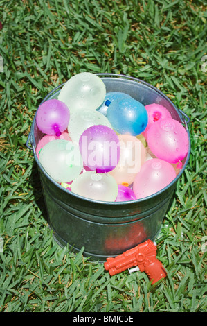 bucket full of colorful water balloons ready for battle Stock Photo - Alamy