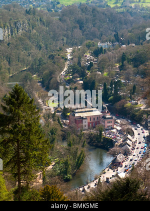 A view looking down the bend of an English river, with lily pads, a ...