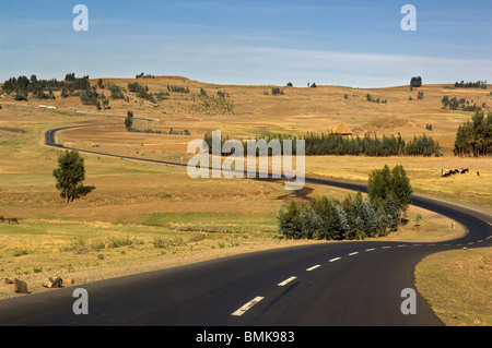 Winding paved road through the Ethiopian Highlands below a rural ...