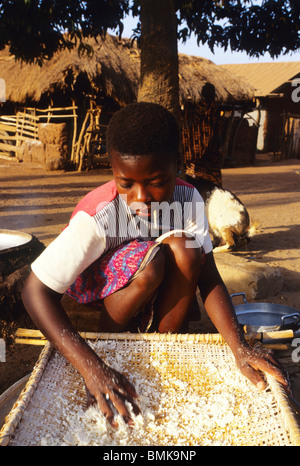 Ghana: Kabile (Brong-Ahafo Region), woman pouring water retrieved from ...