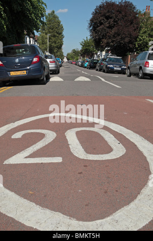 20 MPH speed limit road marking in residential street, London England ...