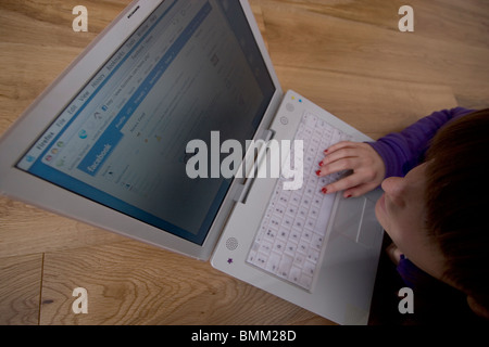 Close-up of a web surfer browsing the Facebook social networking ...