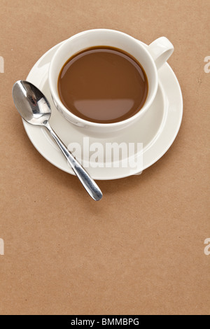 A close up shot of a cup of coffee in a black espresso machine isolated ...