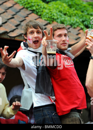 Football fans chanting, singing and celebrating in standing terrace at ...