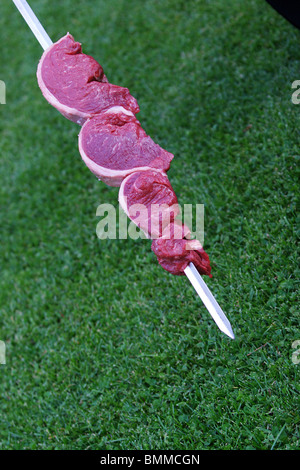"chunks of beef meat threaded on sword for Churrasco grilled Stock ...