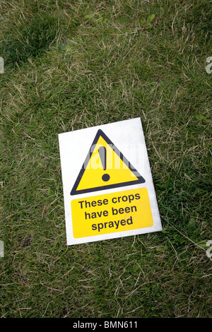 Sign warning of sprayed crops in a Kentish orchard Stock Photo - Alamy
