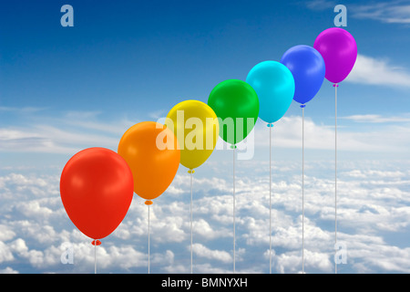 Balloons in rainbow colors against blue sky with clouds. Digital ...
