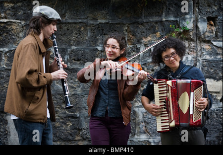 Female street performer playing the accordion, Quebec City, Quebec ...