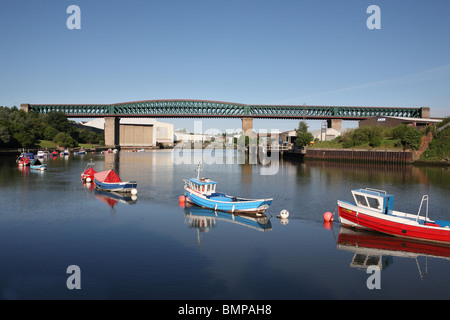 Boats moored beneath the Queen Alexandra Bridge over the river Wear in ...