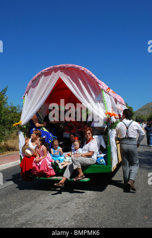Procession of Spanish women and girls in traditional dress during ...
