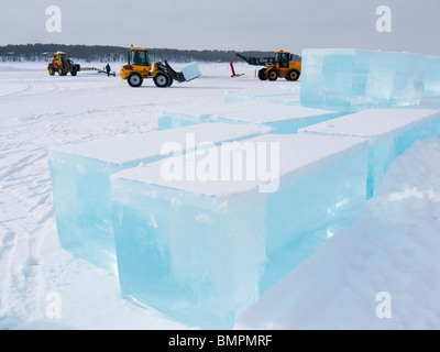Big blocks of ice are being cut and lifted out from the frozen Torne ...