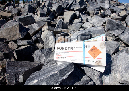 Empty dynamite box on exploded rocks . Bedrock is exploded to smaller ...