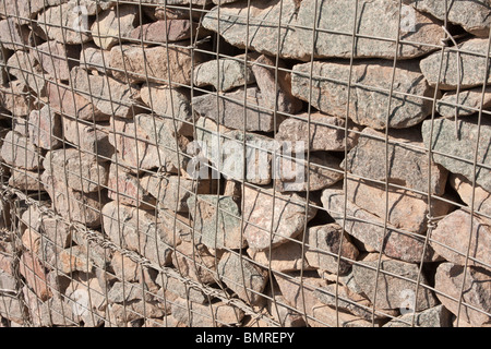 Gabion is a wire cage filled with rocks for use in civil engineering ...