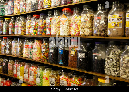 Jars of sweets on shelves at a traditional sweet shop in the Uk Stock ...