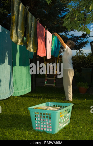 Woman Hanging Laundry in the Wind on the Clothes Line Egilsstadir ...
