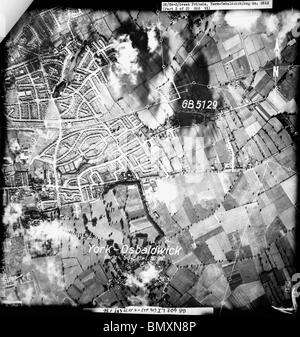 WW2 York Air Raid Bomb Damage Civilians walk pass bomb damaged housing ...