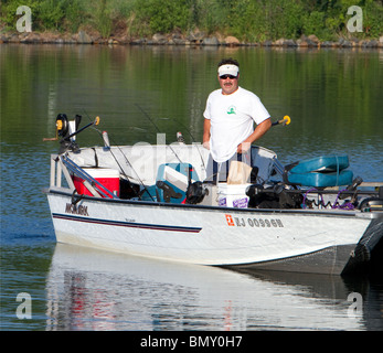 A fisherman getting his boat ready to castoff Stock Photo - Alamy