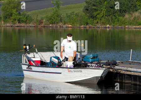 A fisherman getting his boat ready to castoff Stock Photo - Alamy